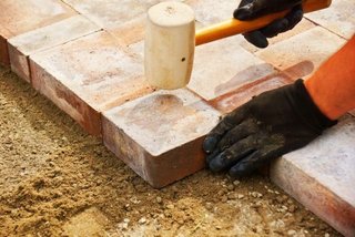 Putting Down Patio Pavers | DoItYourself.com