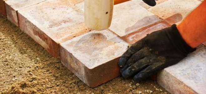 Putting Down Patio Pavers | DoItYourself.com