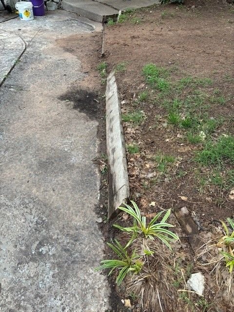 French drain in front of retaining wall - DoItYourself.com Community Forums